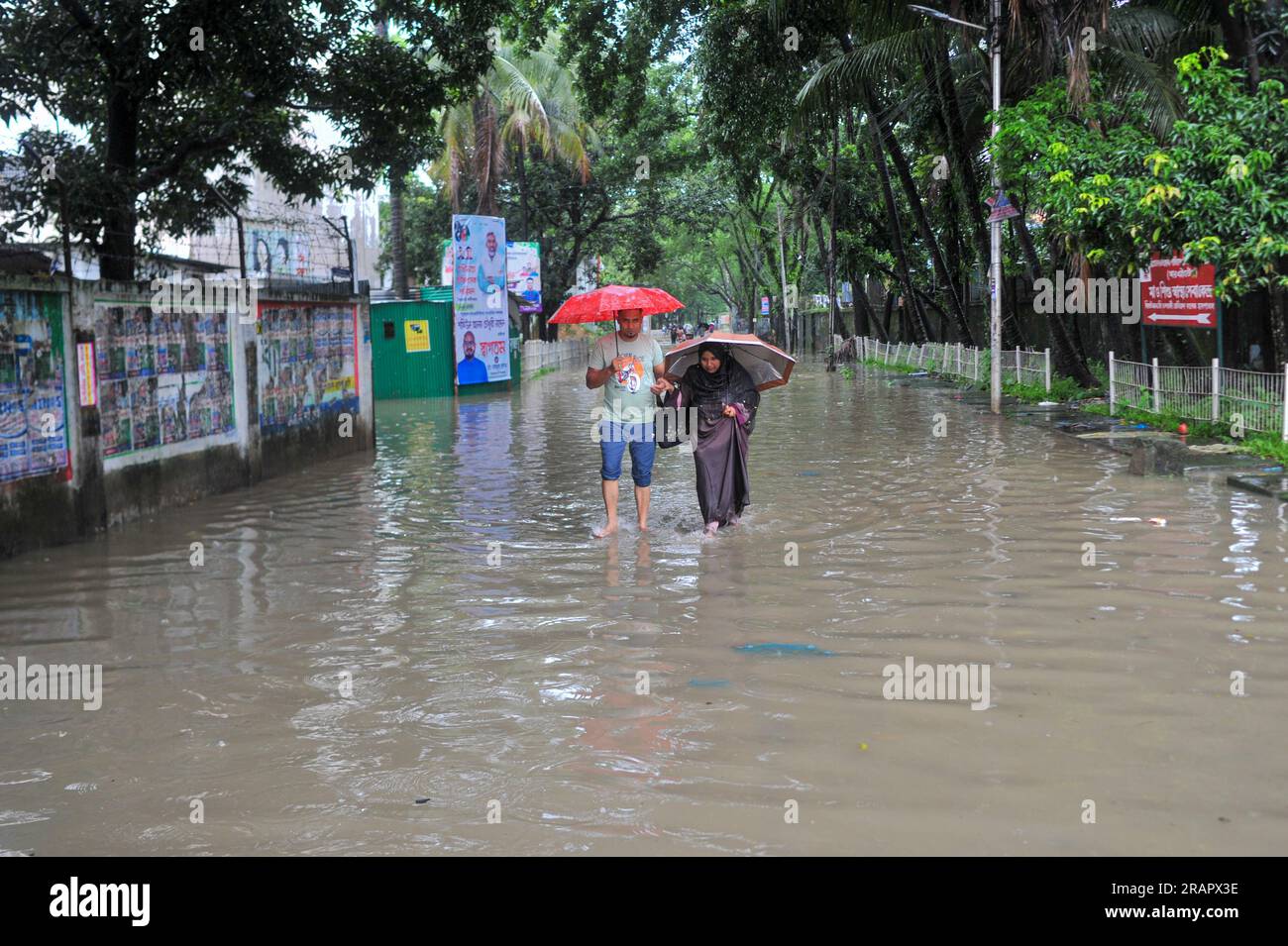 People make their way during heavy rainfall. Incessant rains for the ...