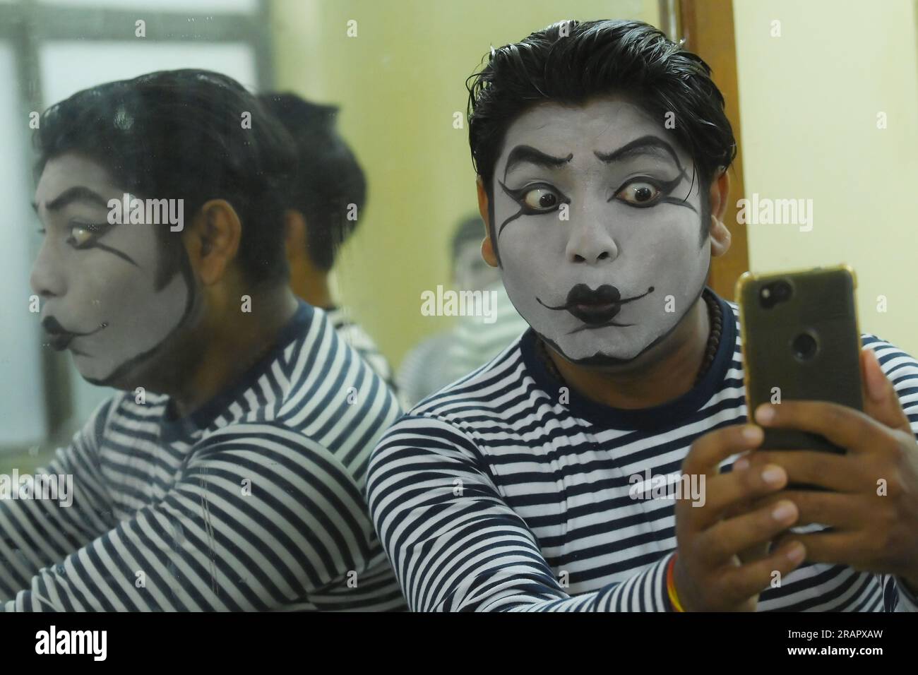 Mime artists from a mime group,"Sur-Pancham", are getting ready for a ...