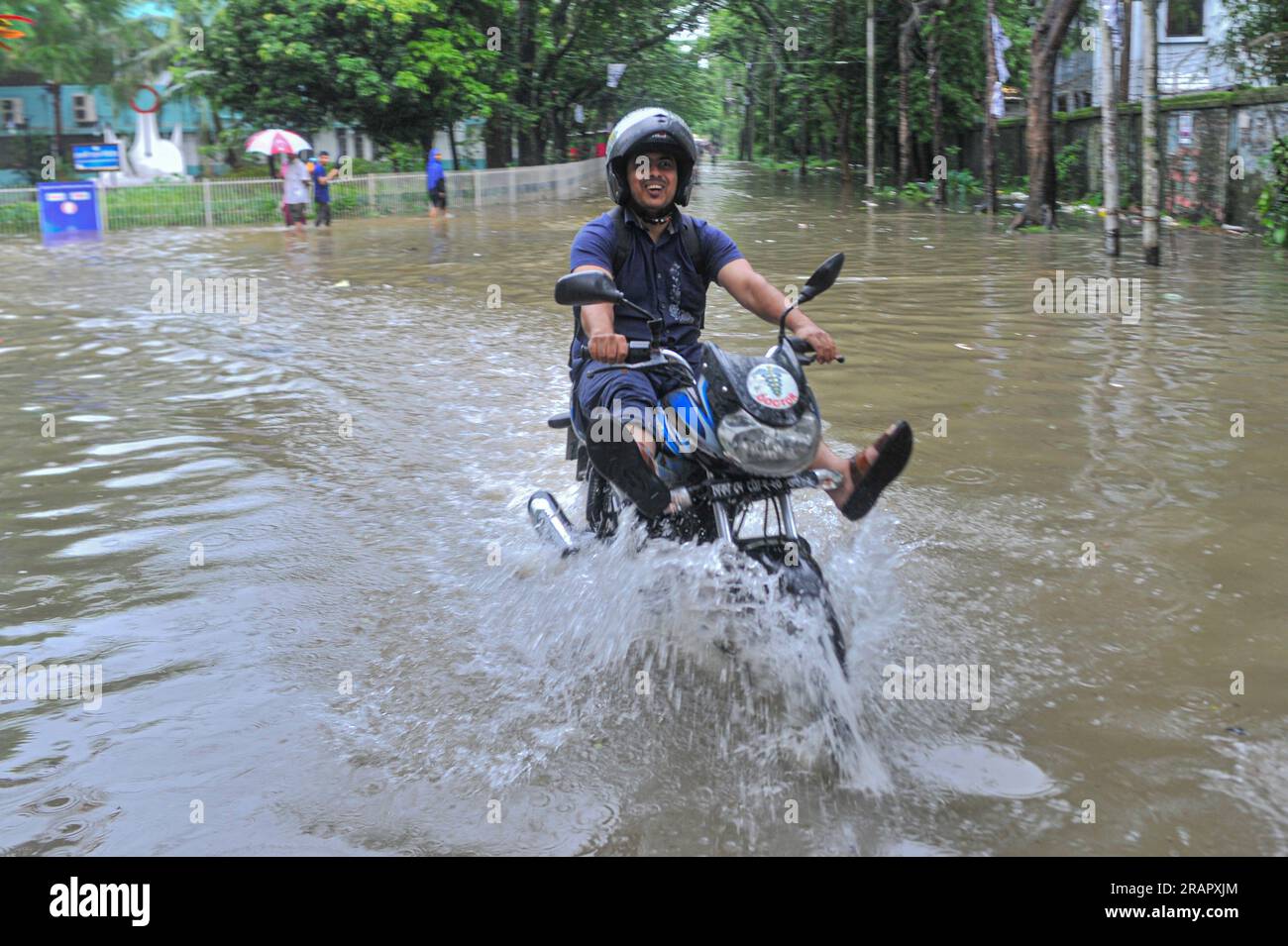 People make their way during heavy rainfall. Incessant rains for the ...