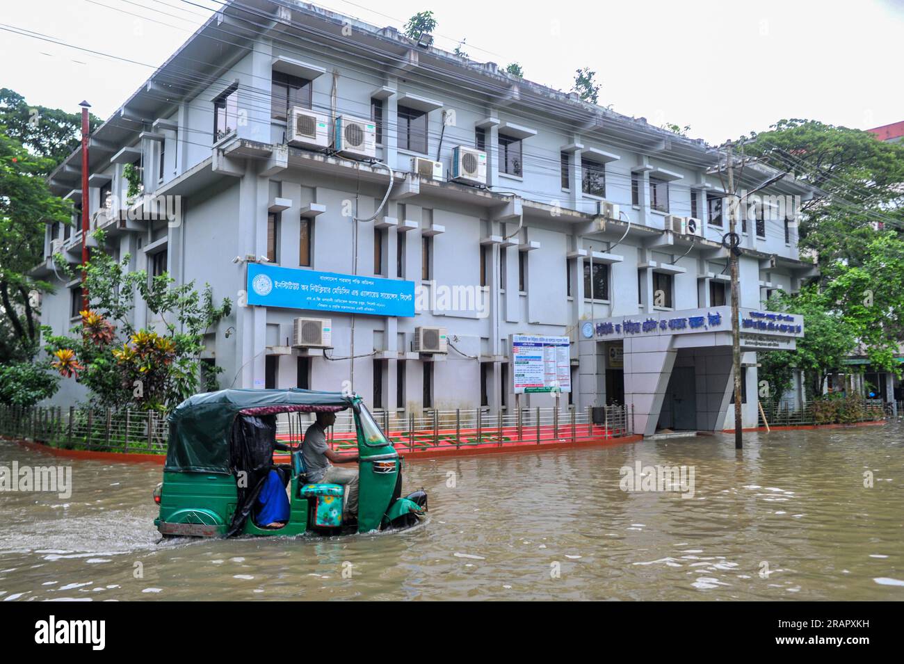 People make their way during heavy rainfall. Incessant rains for the ...