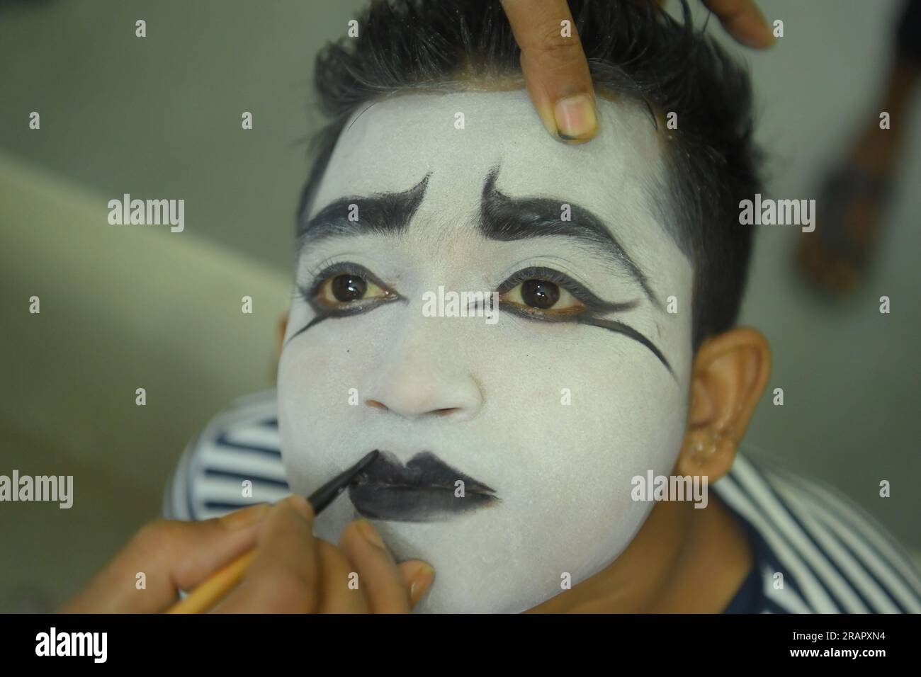 Mime artists from a mime group,"Sur-Pancham", are getting ready for a ...