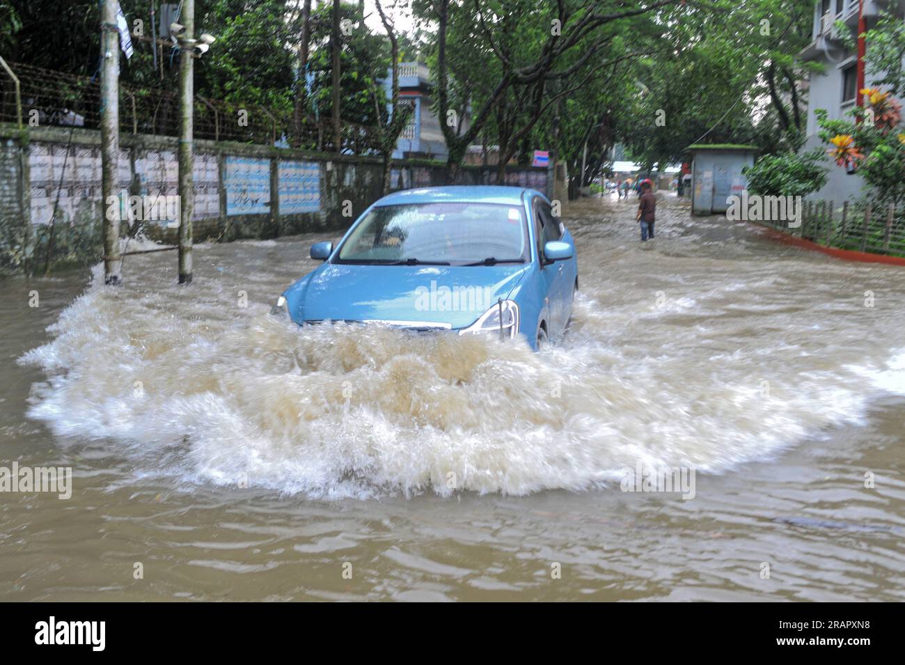 People make their way during heavy rainfall. Incessant rains for the ...