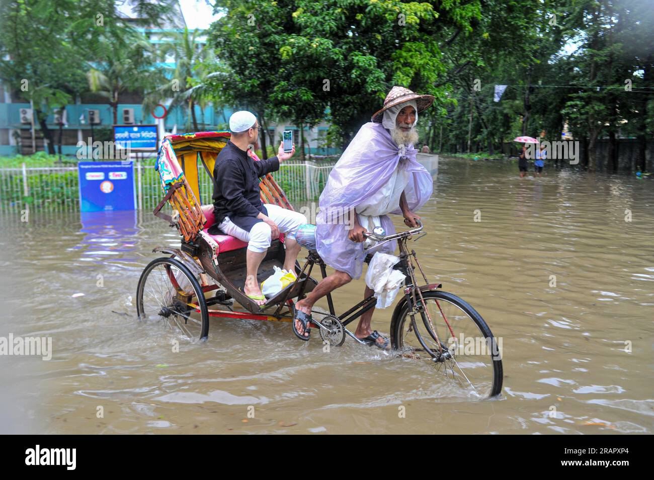 People make their way during heavy rainfall. Incessant rains for the ...
