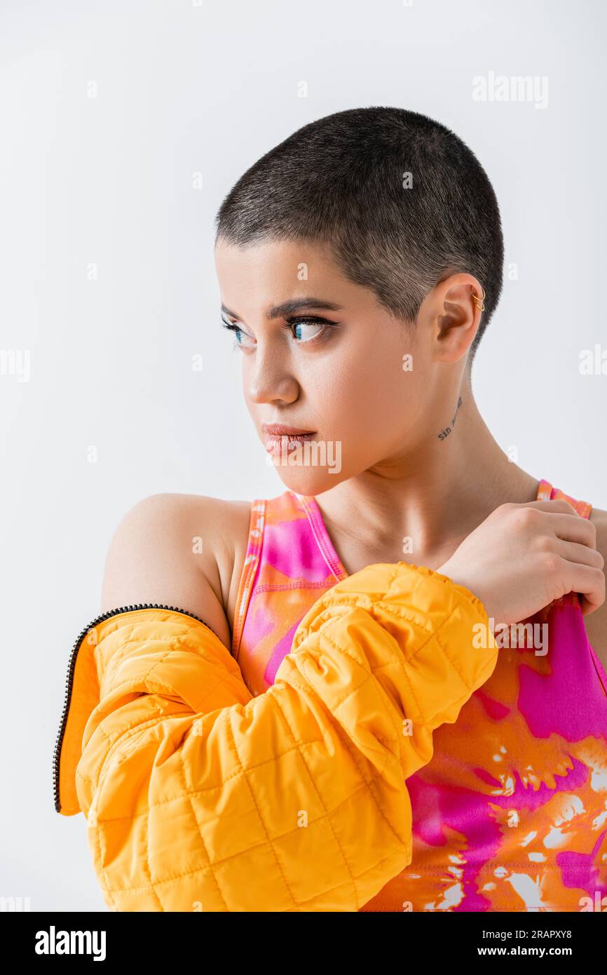 makeup and style, portrait of tattooed young woman with short hair ...