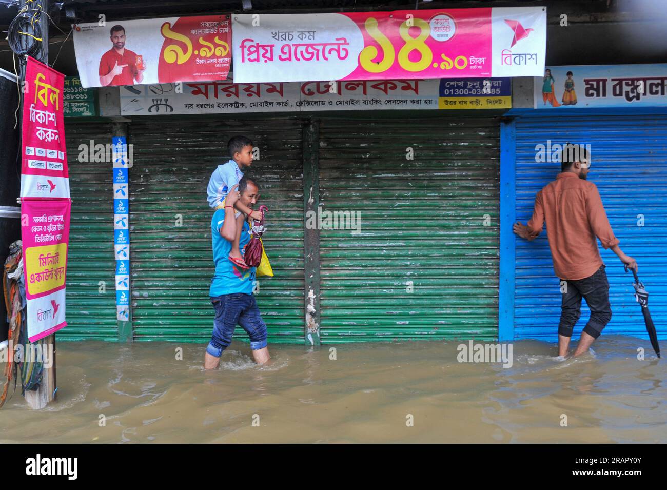 People make their way during heavy rainfall. Incessant rains for the ...