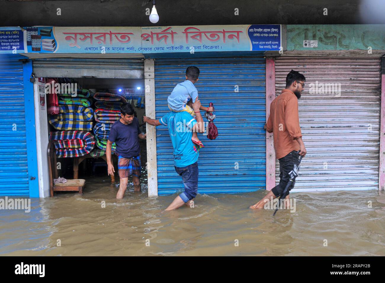 People make their way during heavy rainfall. Incessant rains for the ...