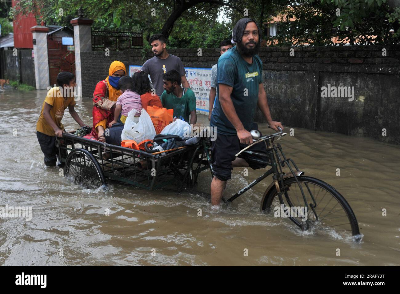 People make their way during heavy rainfall. Incessant rains for the ...