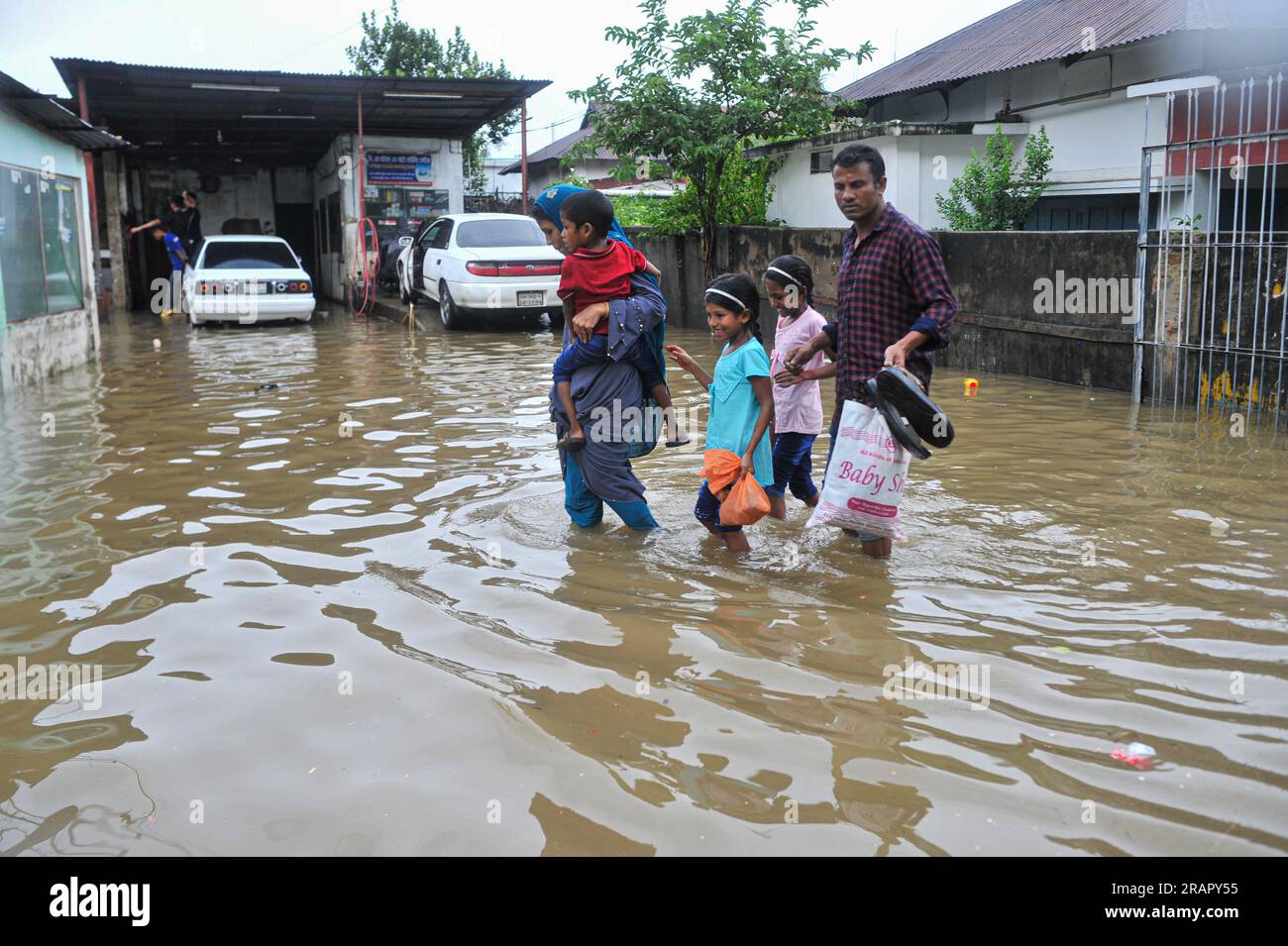 People make their way during heavy rainfall. Incessant rains for the ...