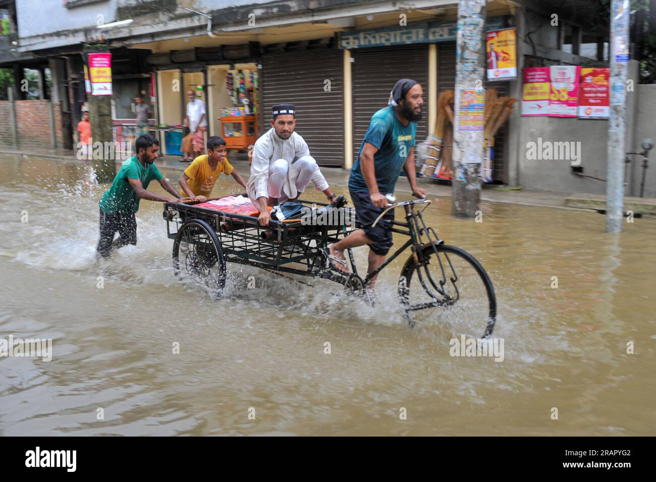 People make their way during heavy rainfall. Incessant rains for the ...