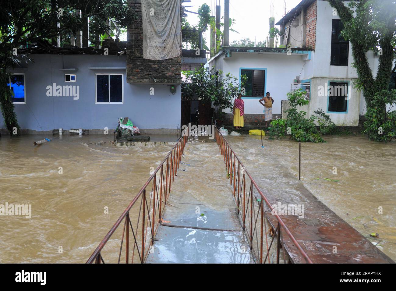 A submerged steel bridge over a big canal during the heavy rainfall. Incessant rains for the ...