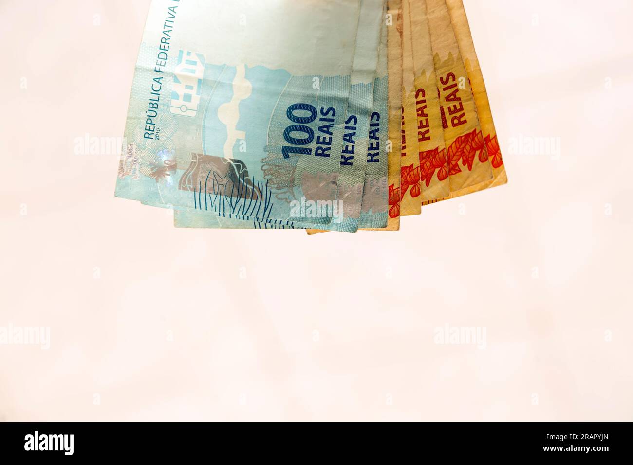 making a payment with brazil money - several hundred banknotes Stock ...