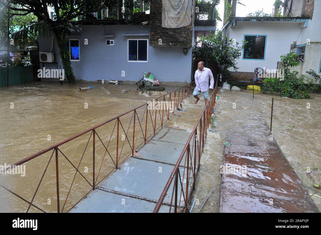 A submerged steel bridge over a big canal during the heavy rainfall ...
