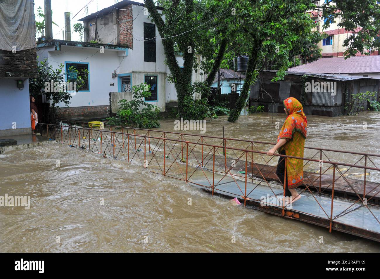 A submerged steel bridge over a big canal during the heavy rainfall. Incessant rains for the ...