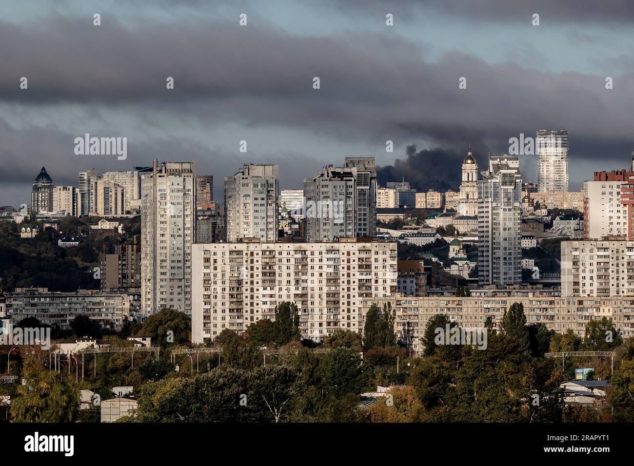 KYIV, UKRAINE - OCT 10 2022: Smoke rises over the city skyline after ...