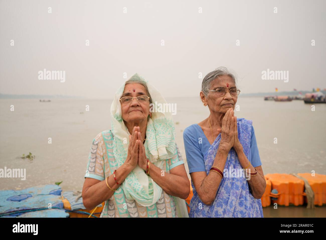 Hindu devotees perform rituals at Sangam, the confluence of the rivers ...