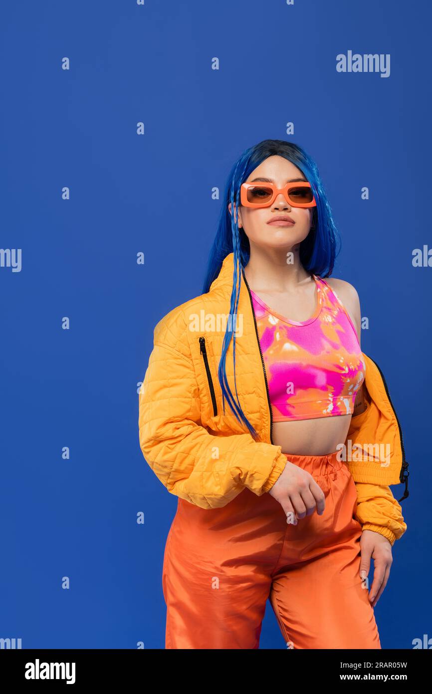 gen z, fashion statement, young female model with blue hair adjusting ...