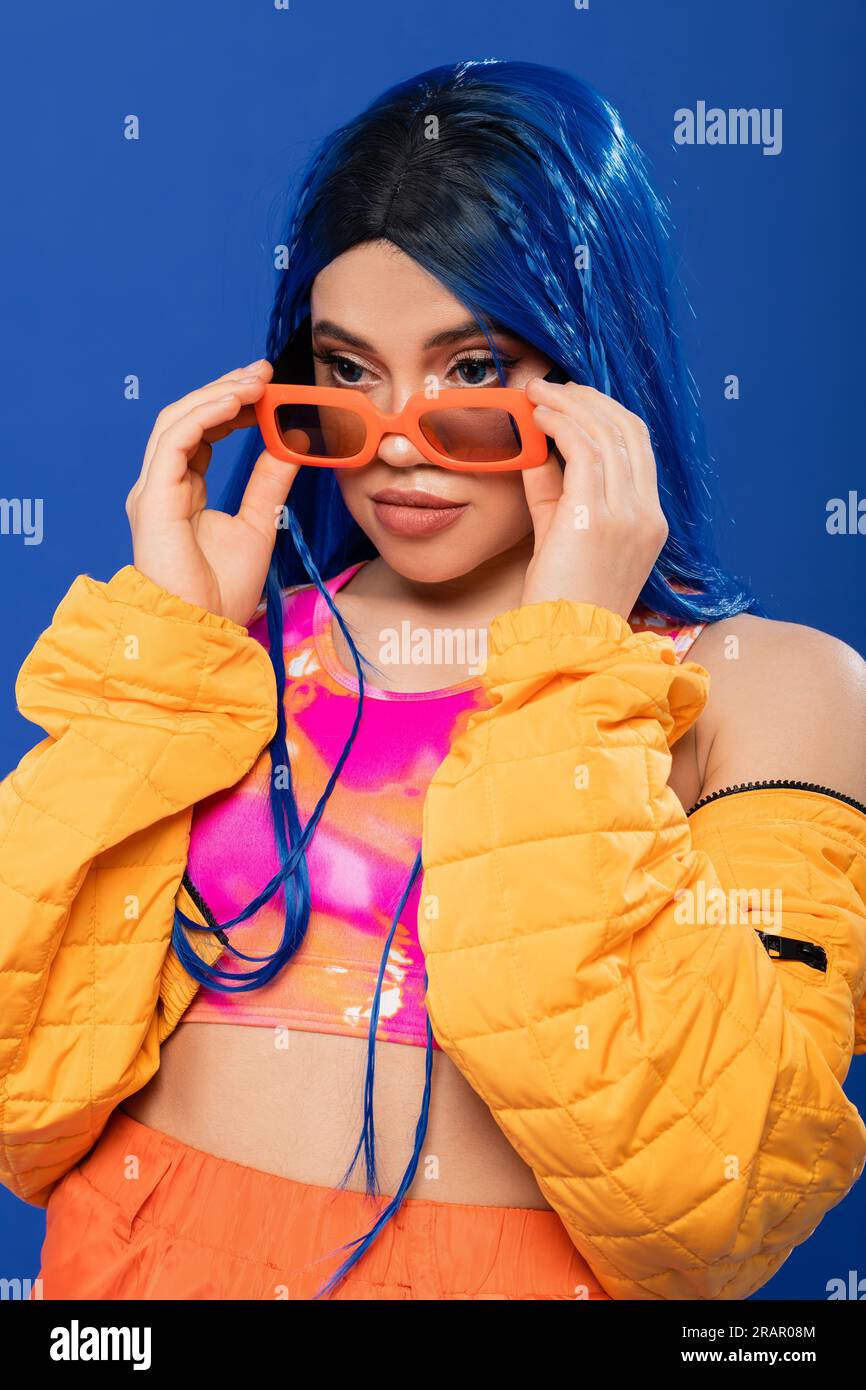 fashion and style, young female model with blue hair and braids wearing ...