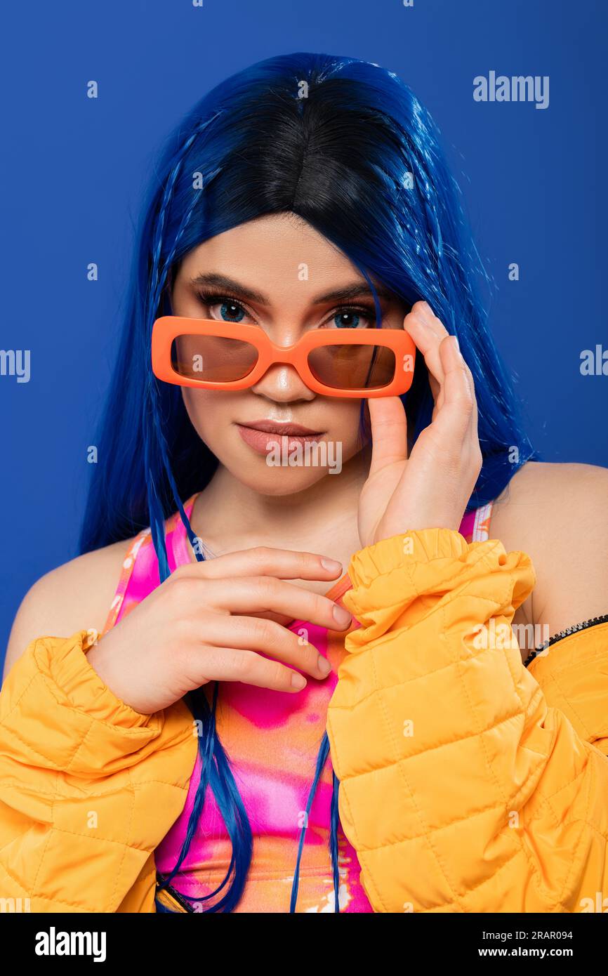 fashion and style, young female model with blue hair and braids wearing ...