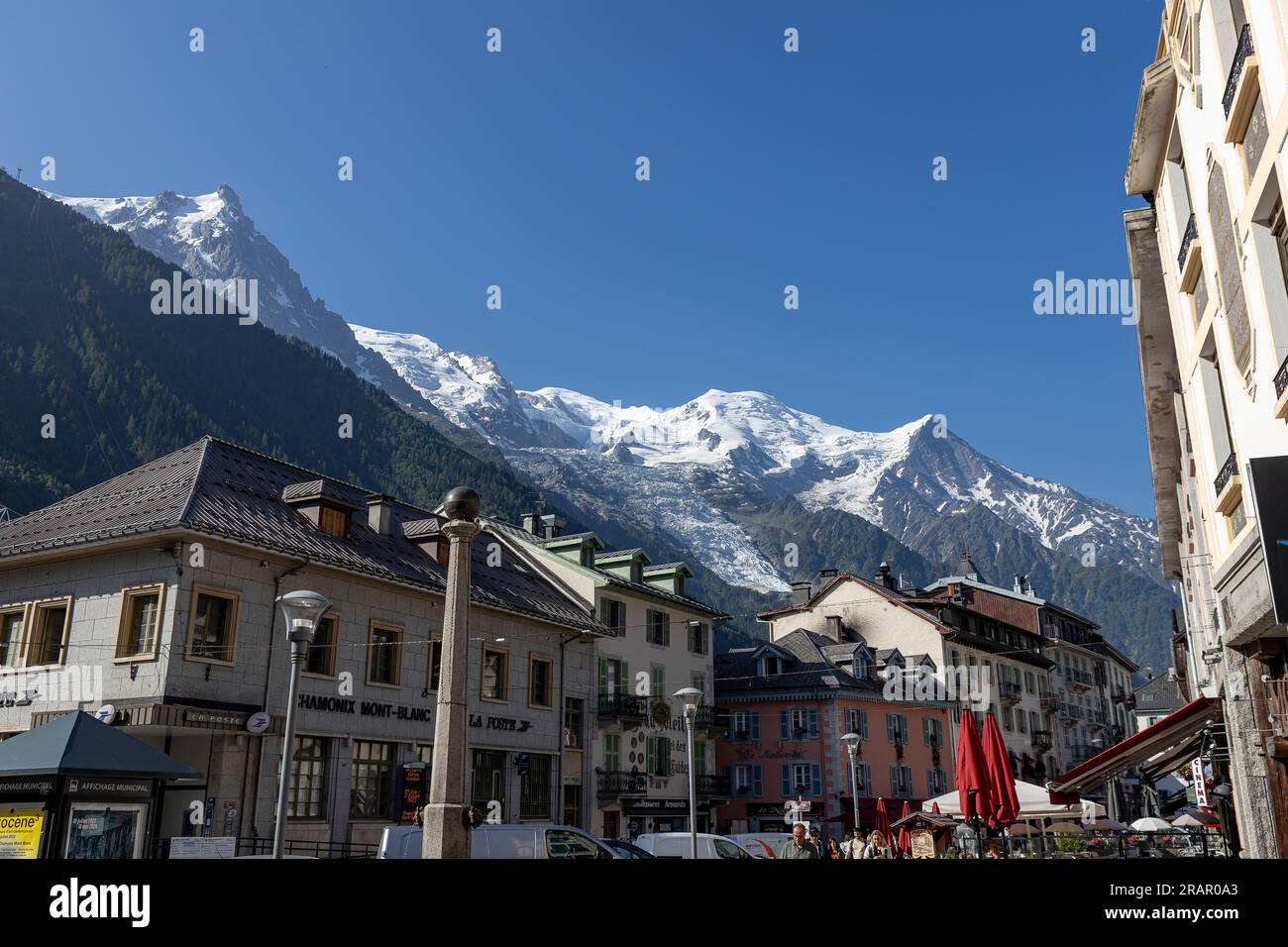 Chamonix village at the feet of the Mont Blanc Massive mountain range with eternal snow tops in ...