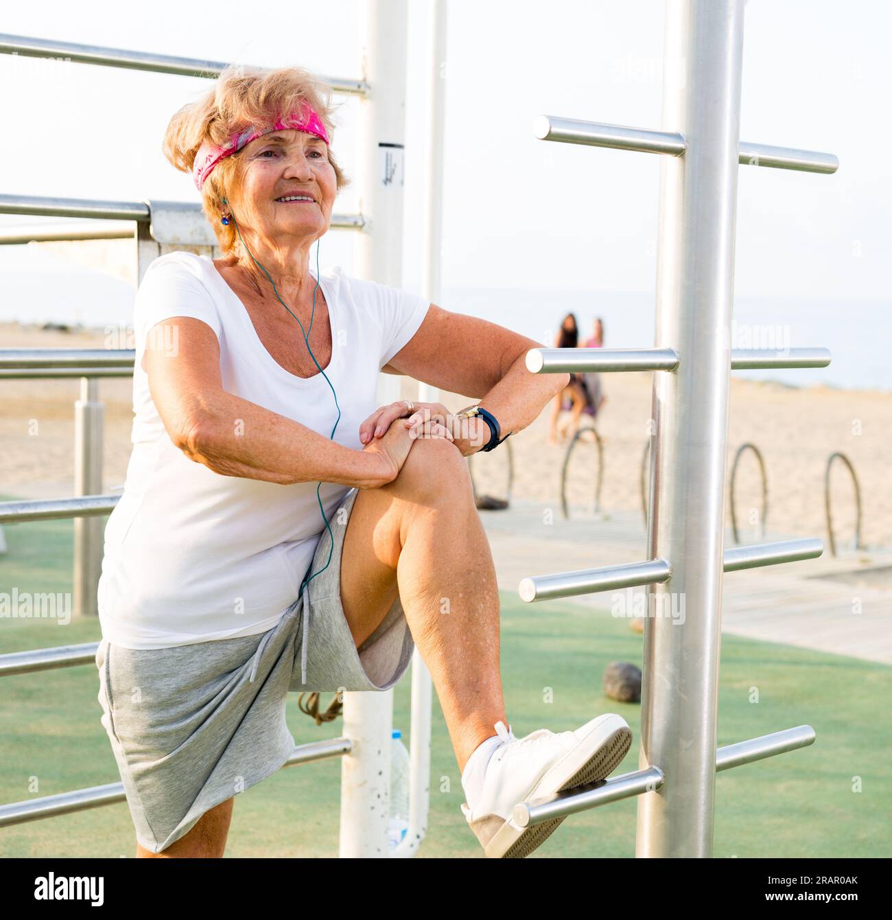 Old woman doing fitness exercises outdoors Stock Photo - Alamy