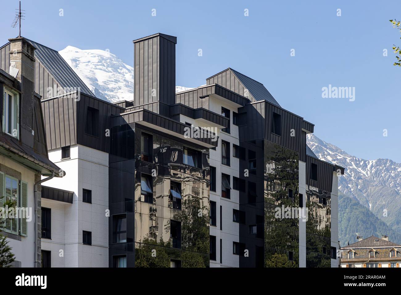 Chamonix village at the feet of the Mont Blanc Massive mountain range with eternal snow tops in ...