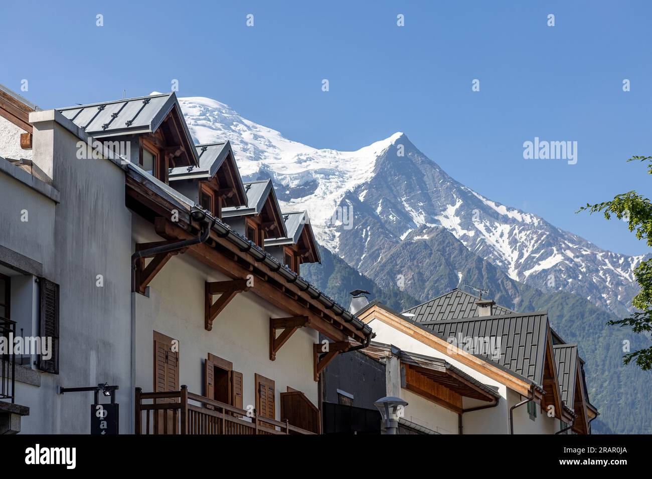 Chamonix village at the feet of the Mont Blanc Massive mountain range with eternal snow tops in ...
