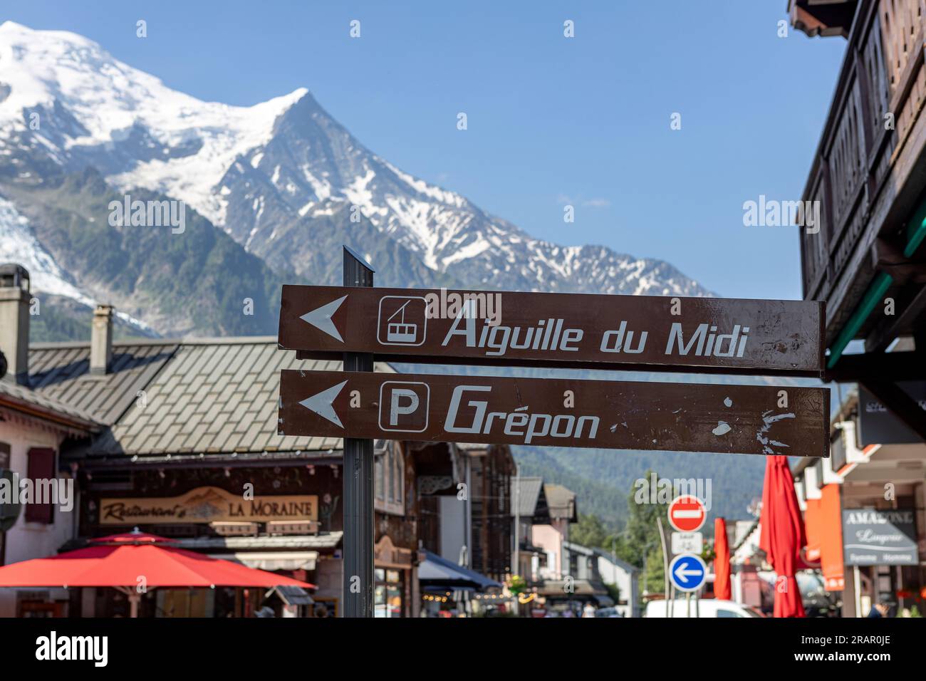 Chamonix village at the feet of the Mont Blanc Massive mountain range with eternal snow tops in ...
