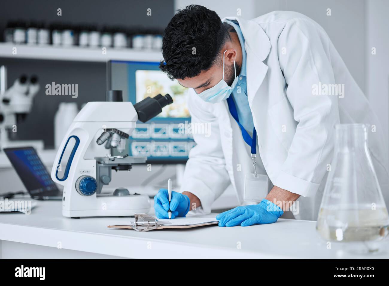 Research, writing and science with man in laboratory for report ...