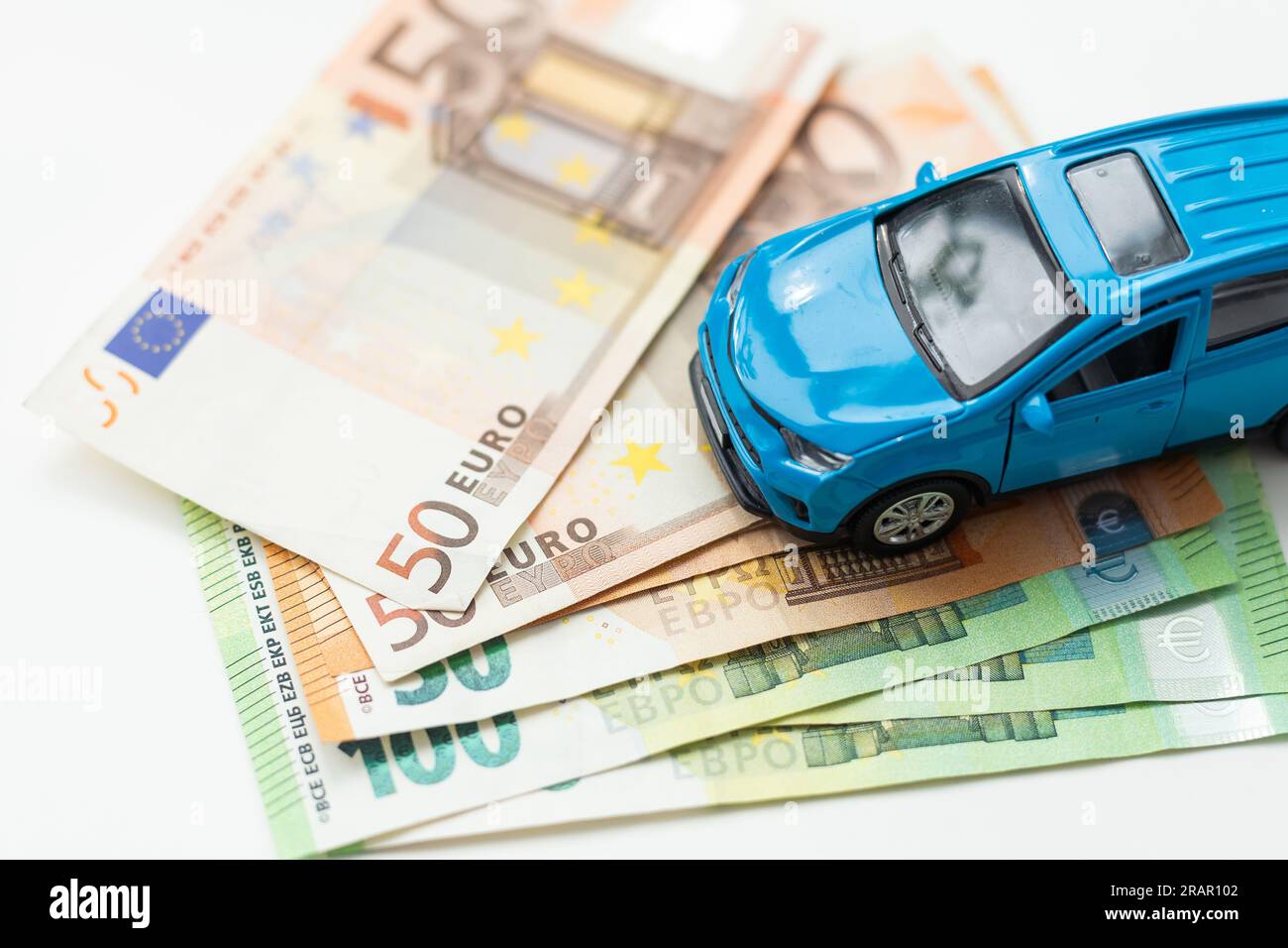 Toy automobile and real keys on euro banknote background Stock Photo ...