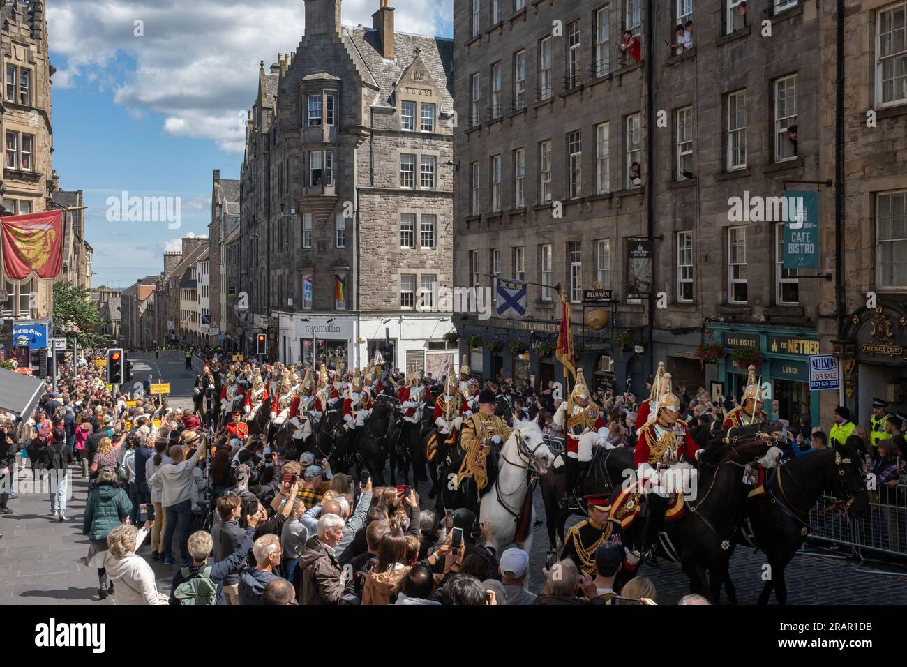 Edinburgh, Scotland, 5th July 2023. People stand on the Royal Mile High ...