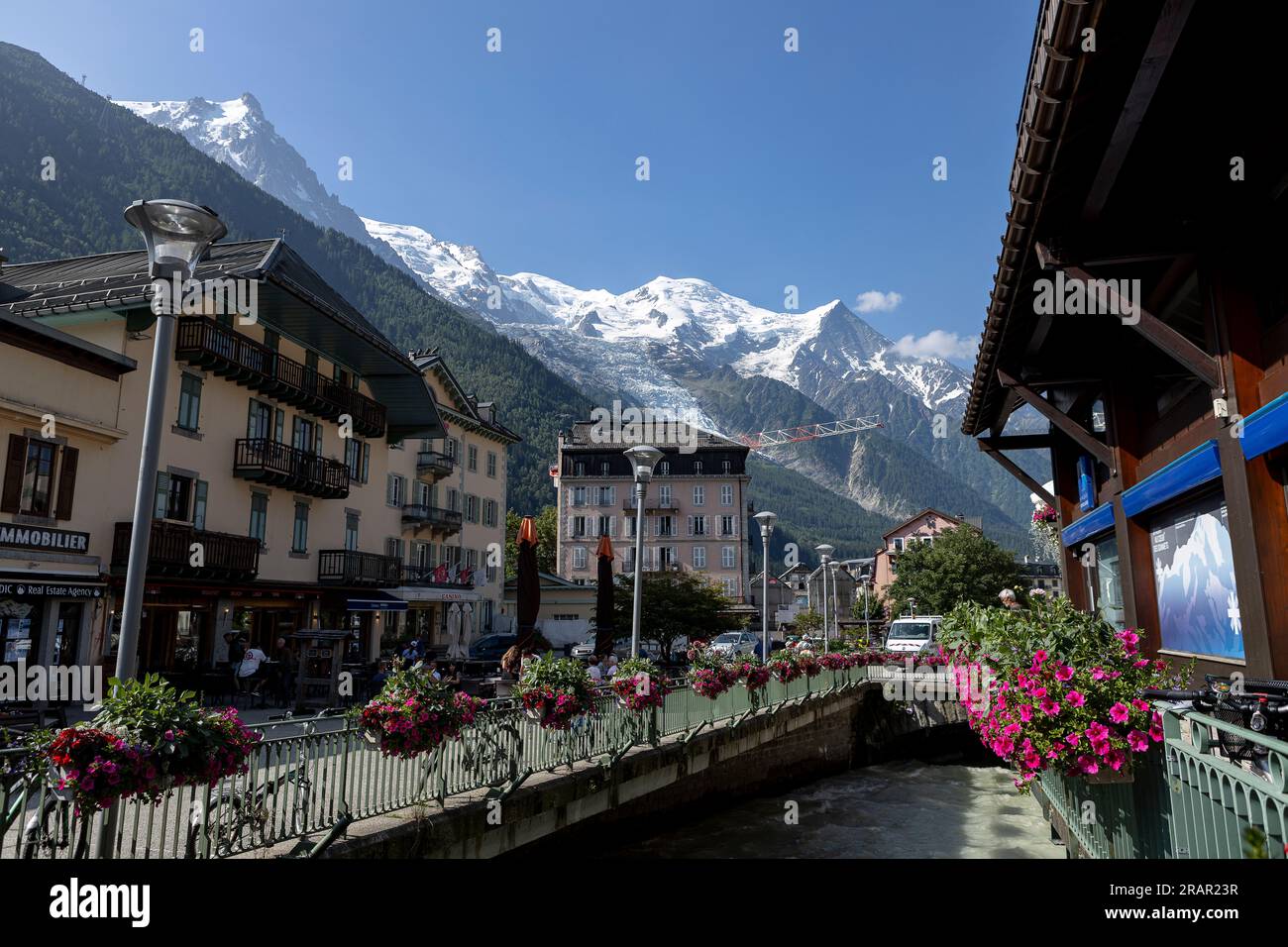Chamonix village at the feet of the Mont Blanc Massive mountain range with eternal snow tops in ...