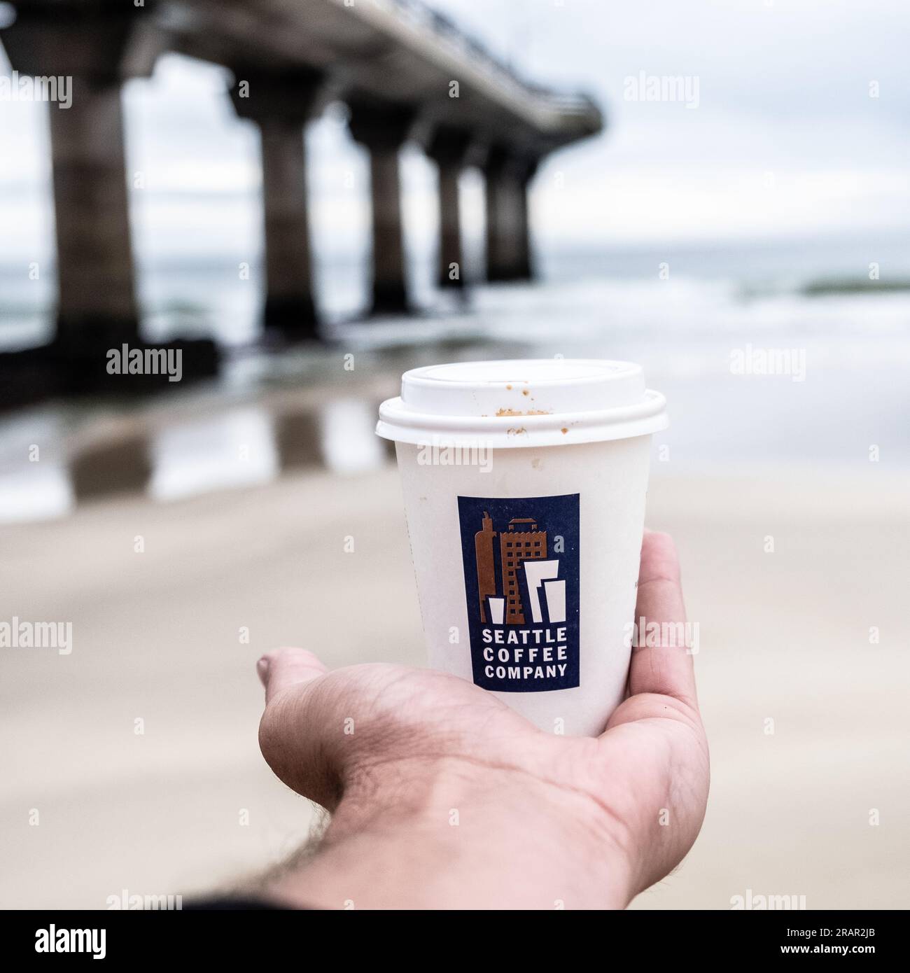Seattle coffee cup with a background of the South African ocean and ...