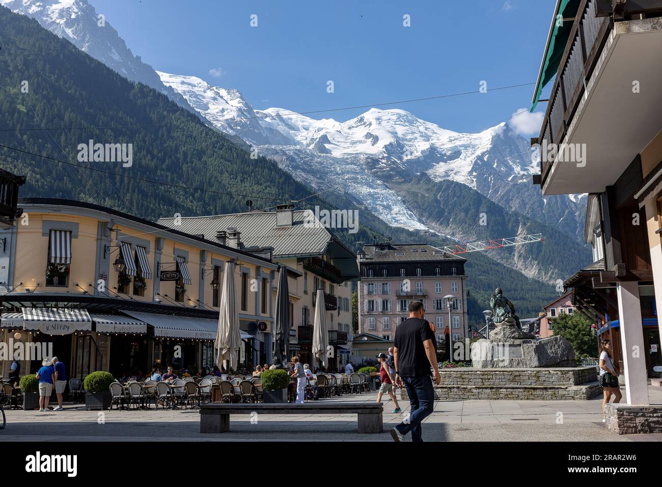 Chamonix village at the feet of the Mont Blanc Massive mountain range with eternal snow tops in ...