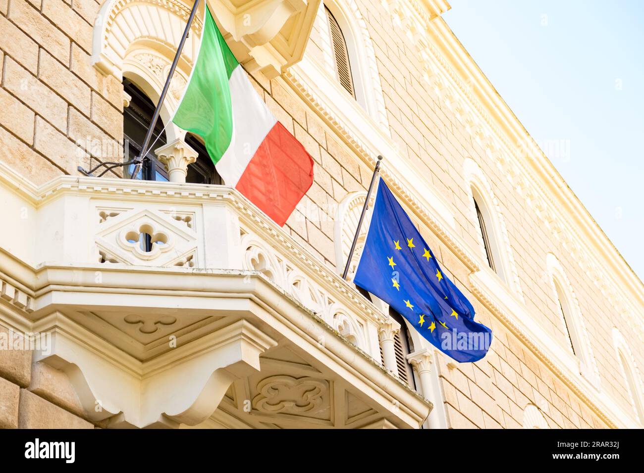 The Italian flag and the European flag wave on the Baroque-style ...