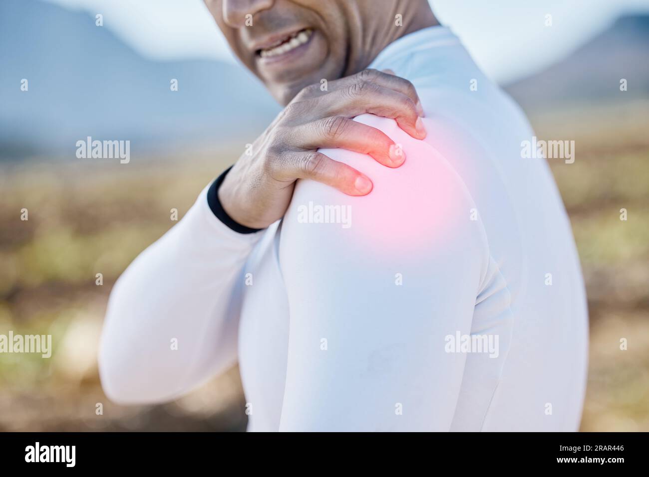 Biker, hand or man with shoulder pain, injury or inflammation outdoors ...