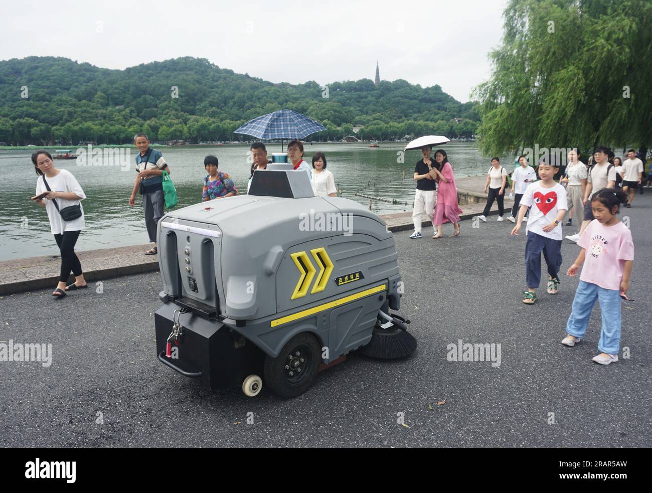 HANGZHOU, CHINA - JULY 5, 2023 - An intelligent sweeping robot performs ...