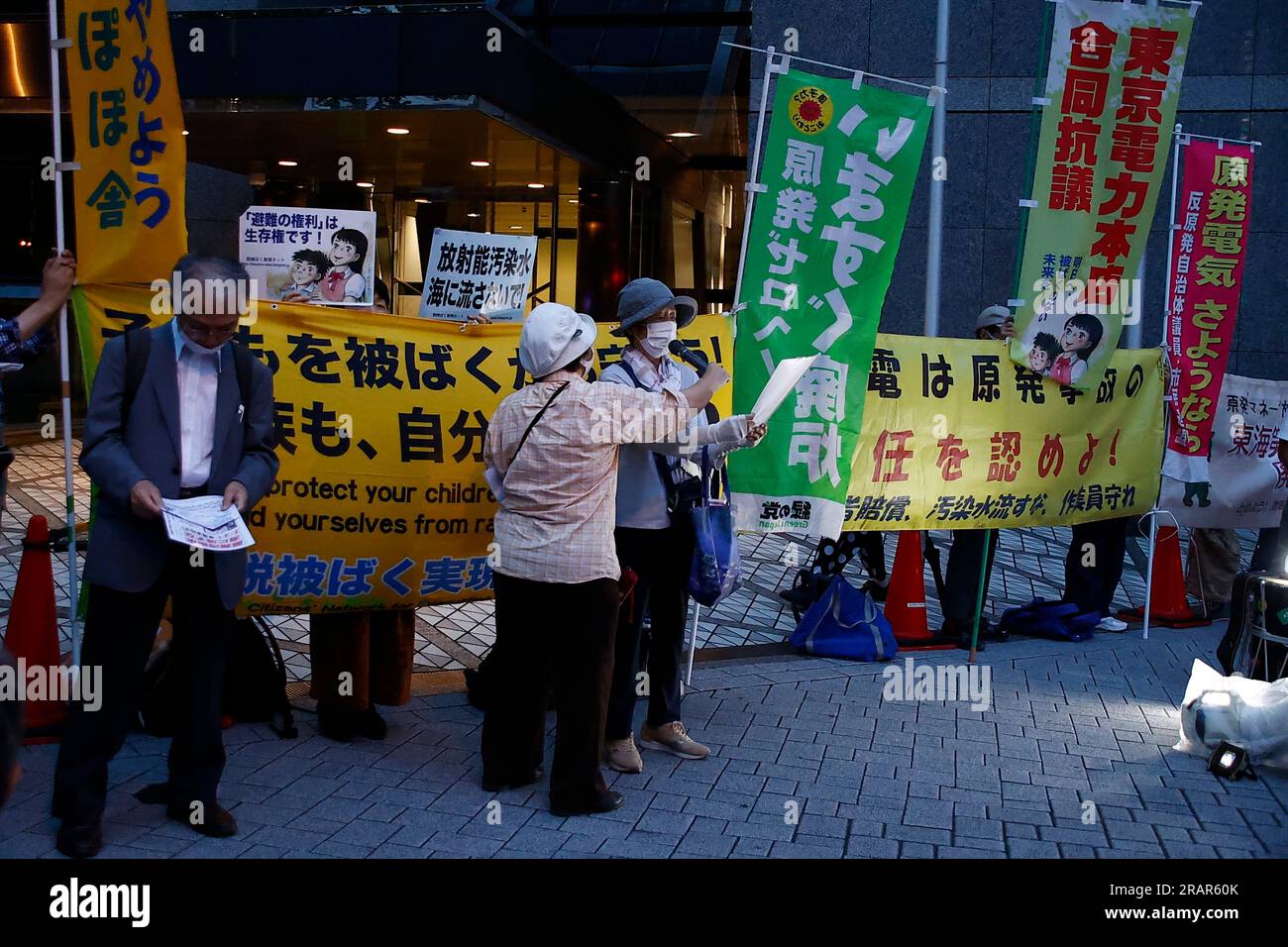 Tokyo, Japan. 5th July, 2023. People holding NO NUKES placards protest ...