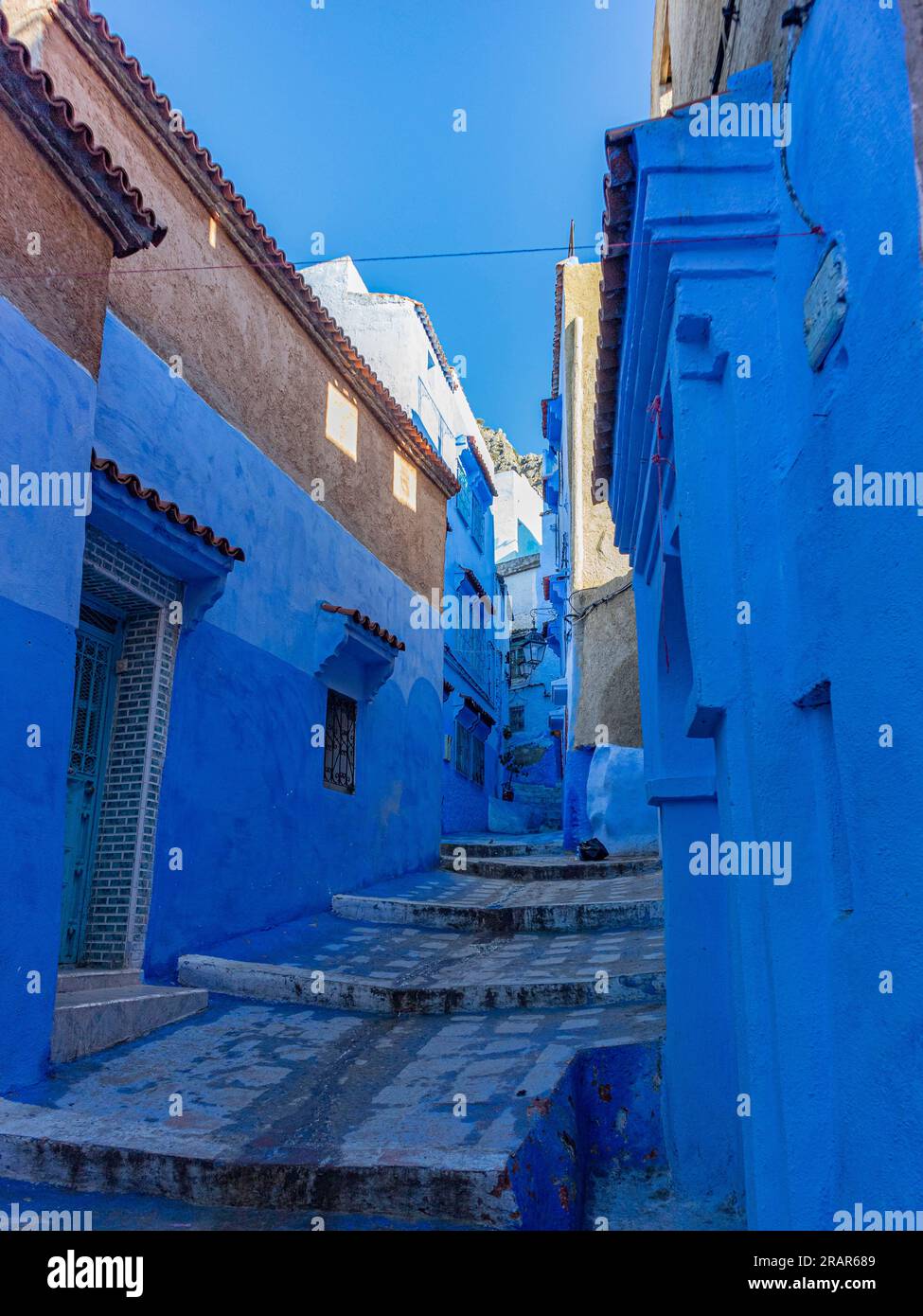 Historical city architecture against blue sky; empty facade blends ...