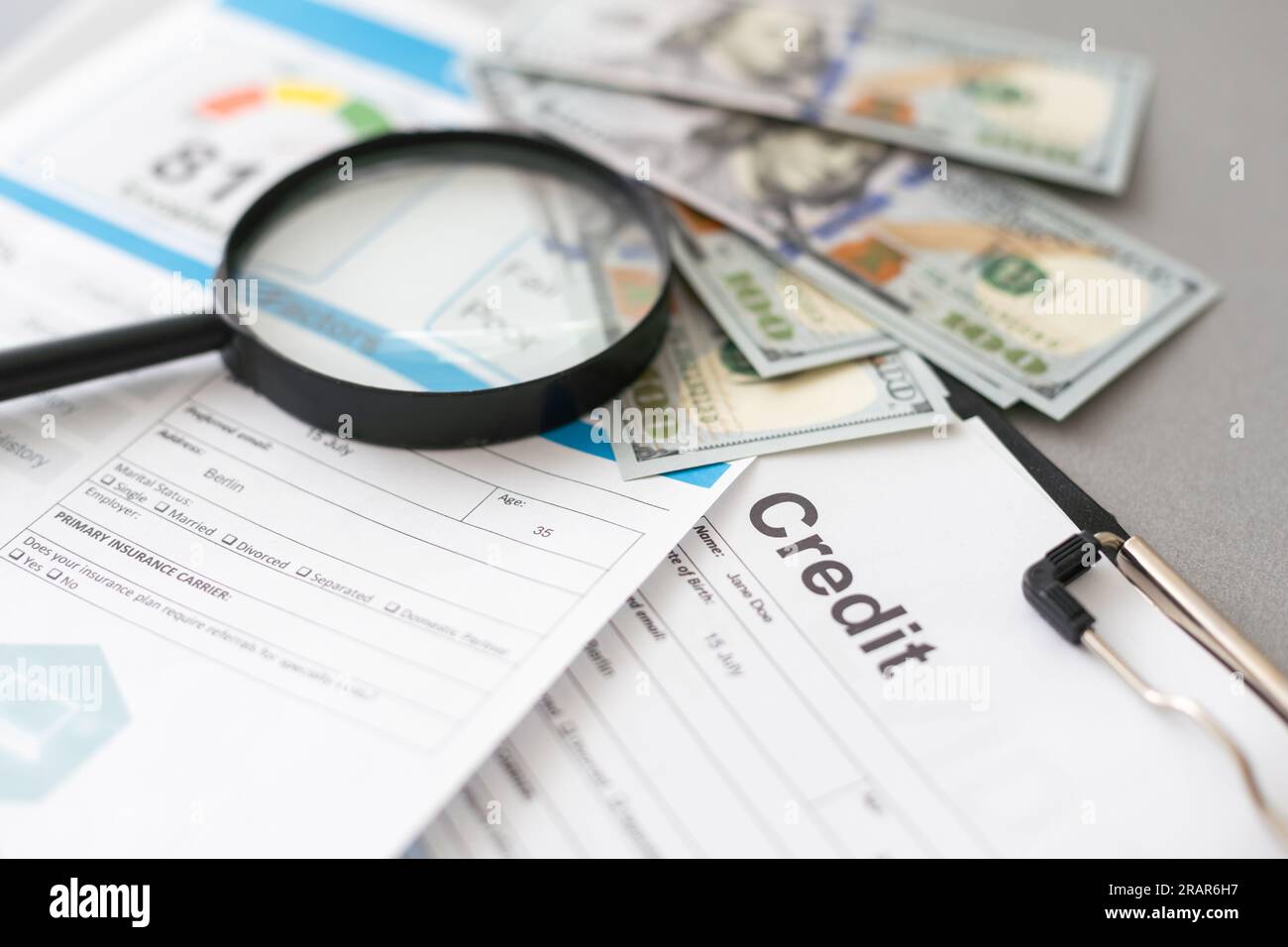Magnifying glass, pen and calculator on financial chart and graph ...