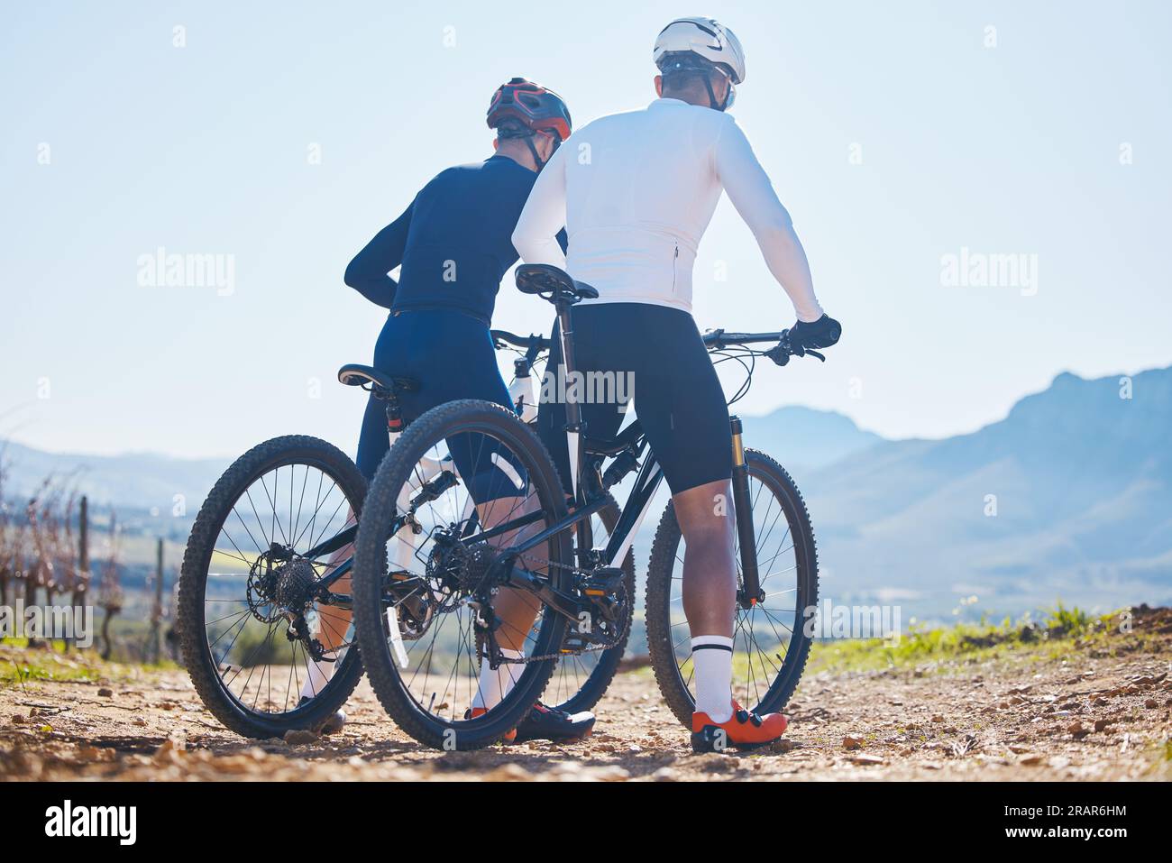 Man looking back cycling hi-res stock photography and images - Alamy