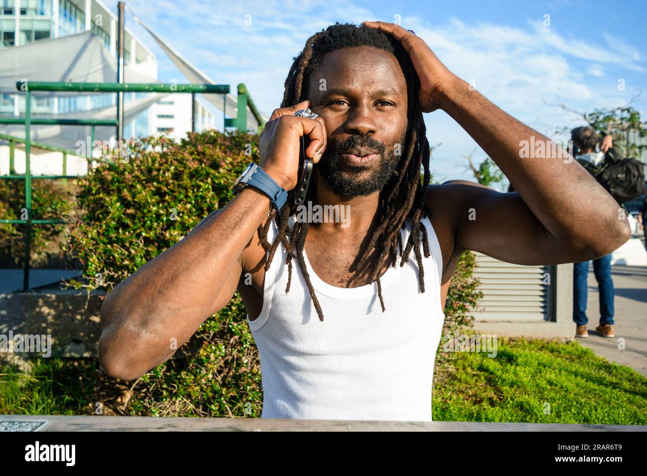 young black man with beard and dreadlocks of African ethnicity, sitting ...