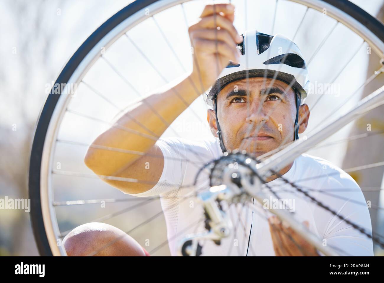 Fixing, bicycle and a man outdoor with wheel puncture or problem while ...