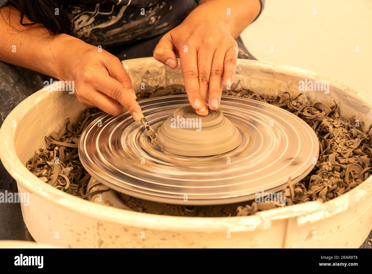 artist working with ceramic clay in her workshop Stock Photo - Alamy