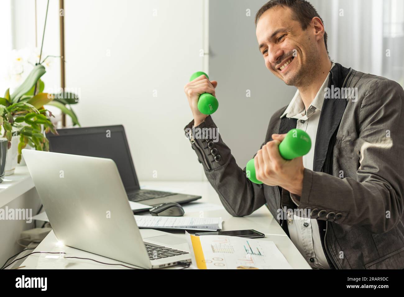 Happy joyful successful caucasian male stock investor, broker, sit at ...