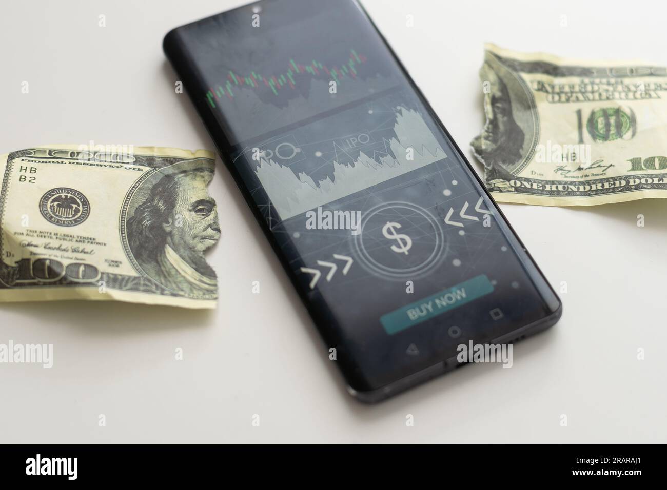 One Hundred Dollar Bill Ripped in Half Isolated on a White Background ...