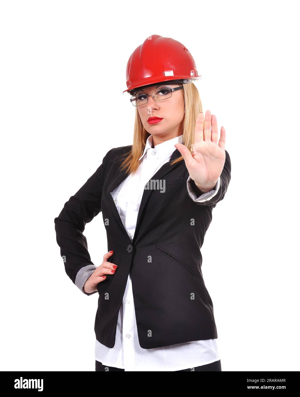 Woman engineer showing stop symbol on white background Stock Photo - Alamy