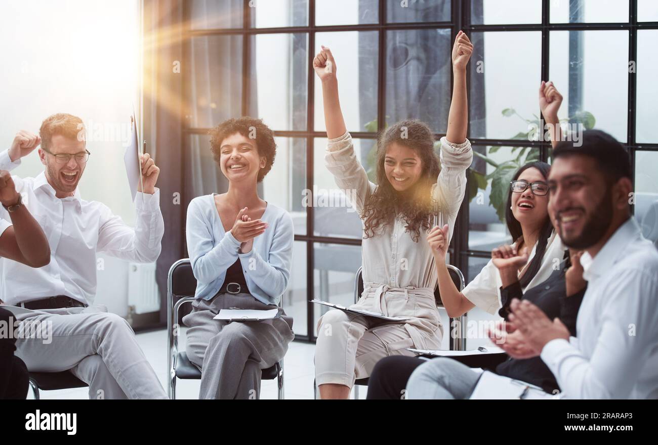 Business people raised arms hi-res stock photography and images - Alamy