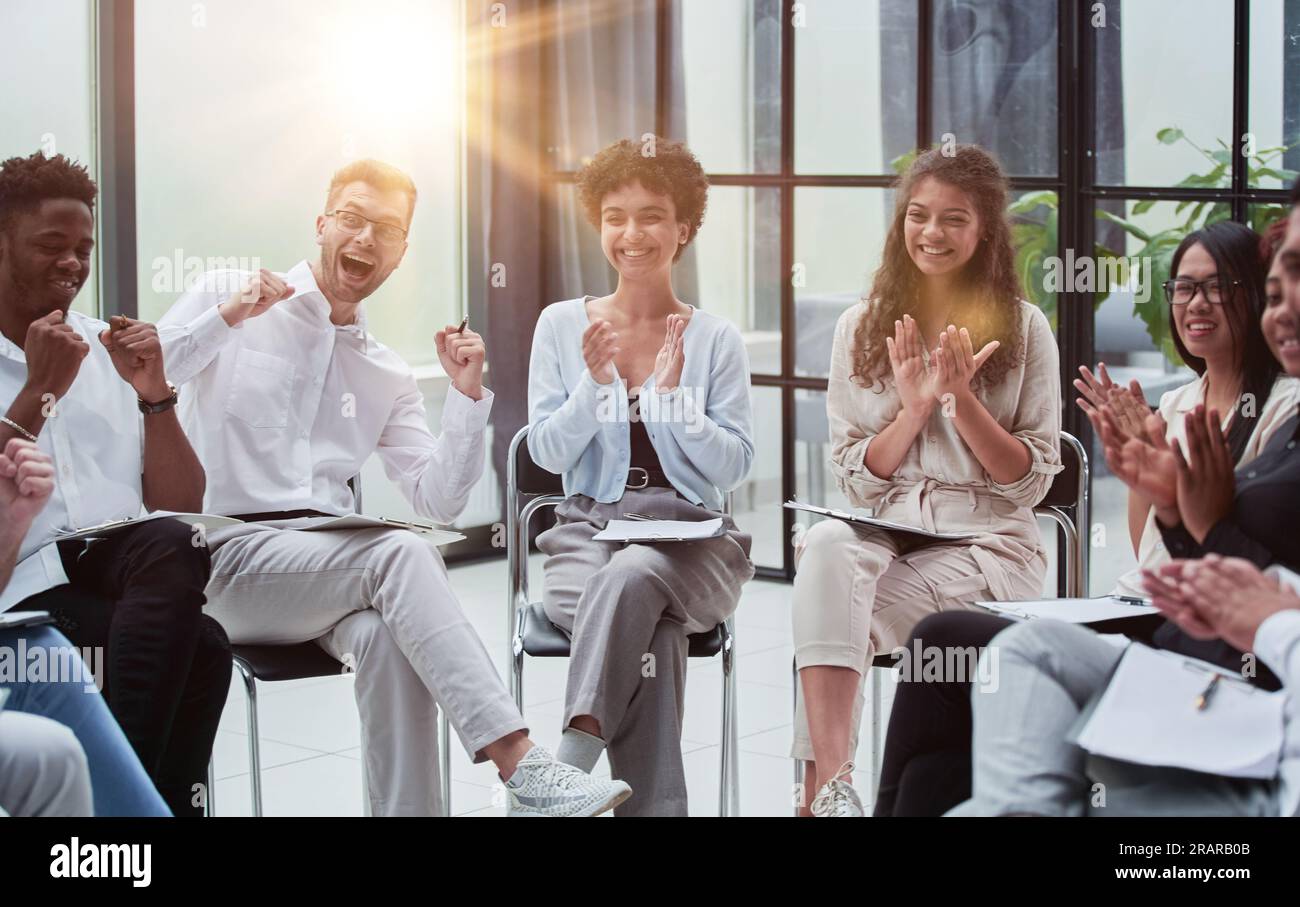 Business people with raised arms during seminar Stock Photo - Alamy