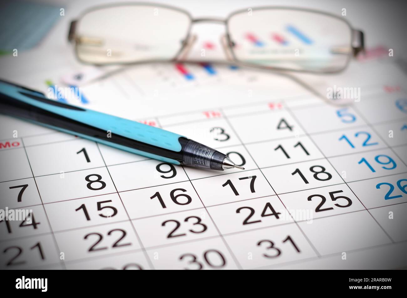 Workplace with calendar, pen and glasses work table Stock Photo - Alamy