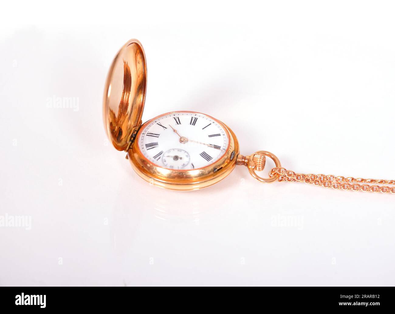 gold pocket watch and chain on white background Stock Photo - Alamy